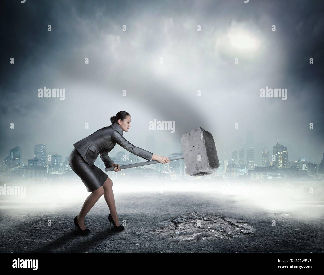 Woman sledge hammer hi-res stock photography and images - Alamy