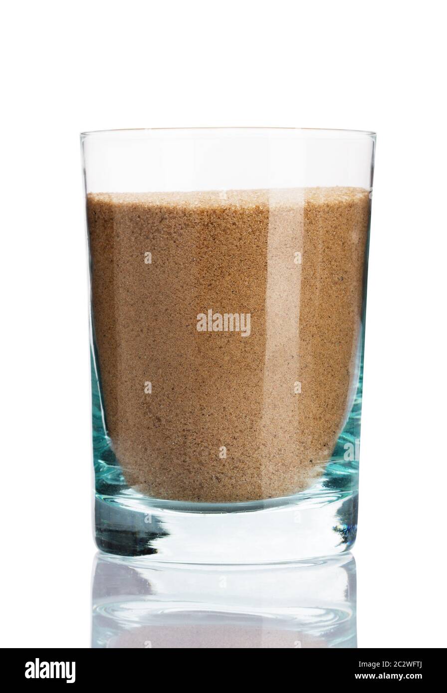 Glass of sand isolated on white Stock Photo - Alamy