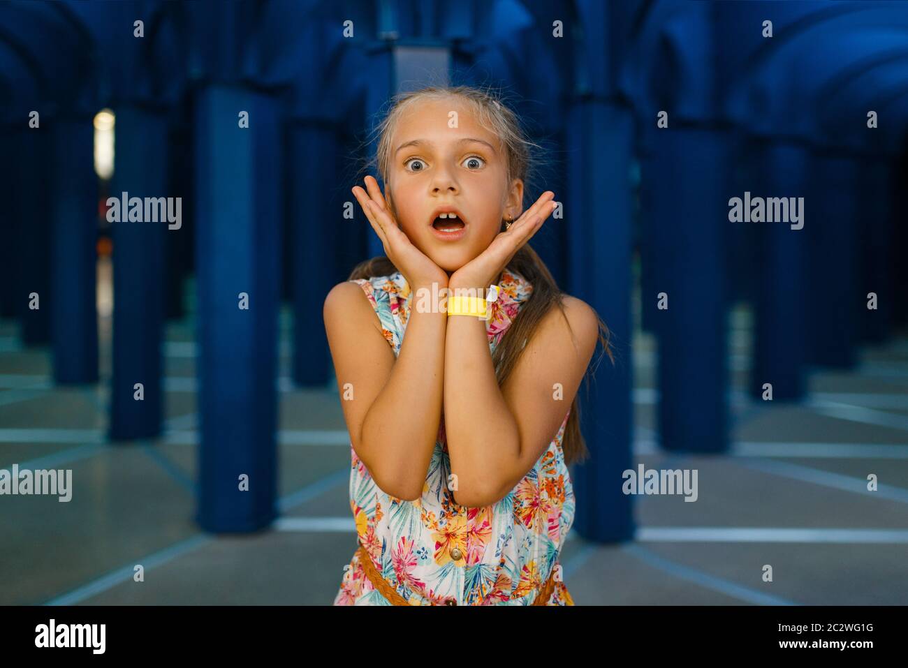 Scared little girl playing in terrible labyrinth, playground in ...