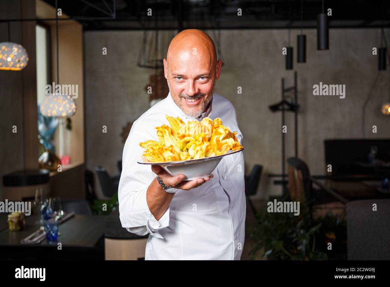 emotional bearded cook in light clothes. Kiev. Ukraine. July 7, 2017 ...