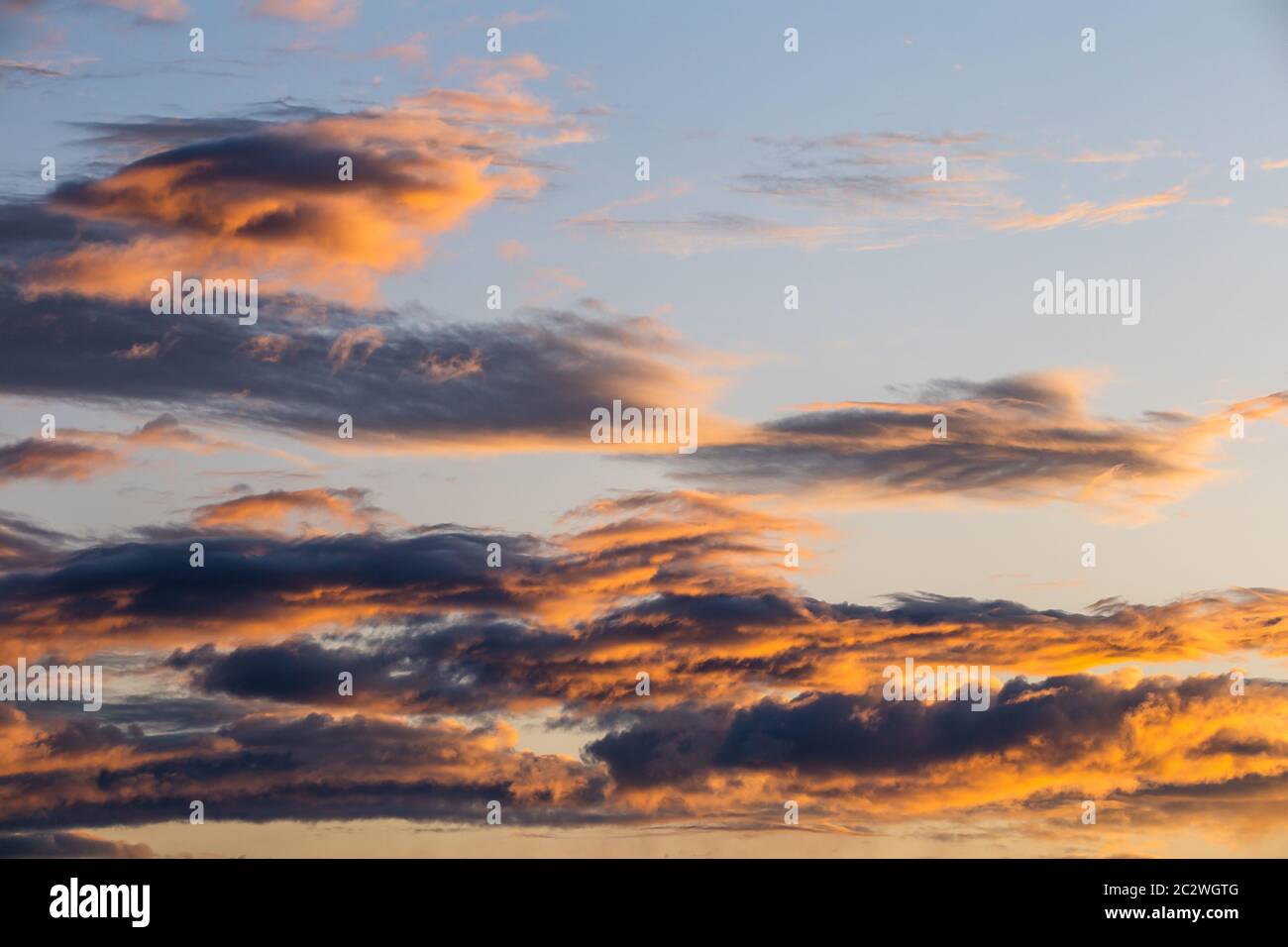 Autumn sky before dawn, the first rays of sunlight color the sky with ...