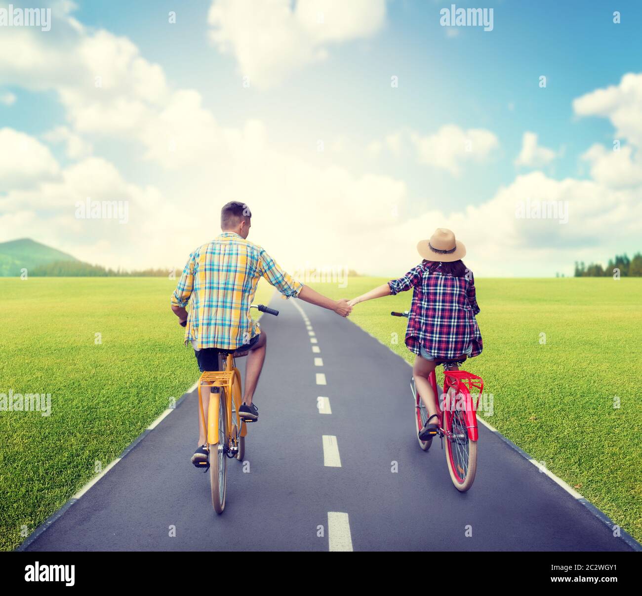 Love couple riding on vintage bikes. Romantic journey of young man and ...