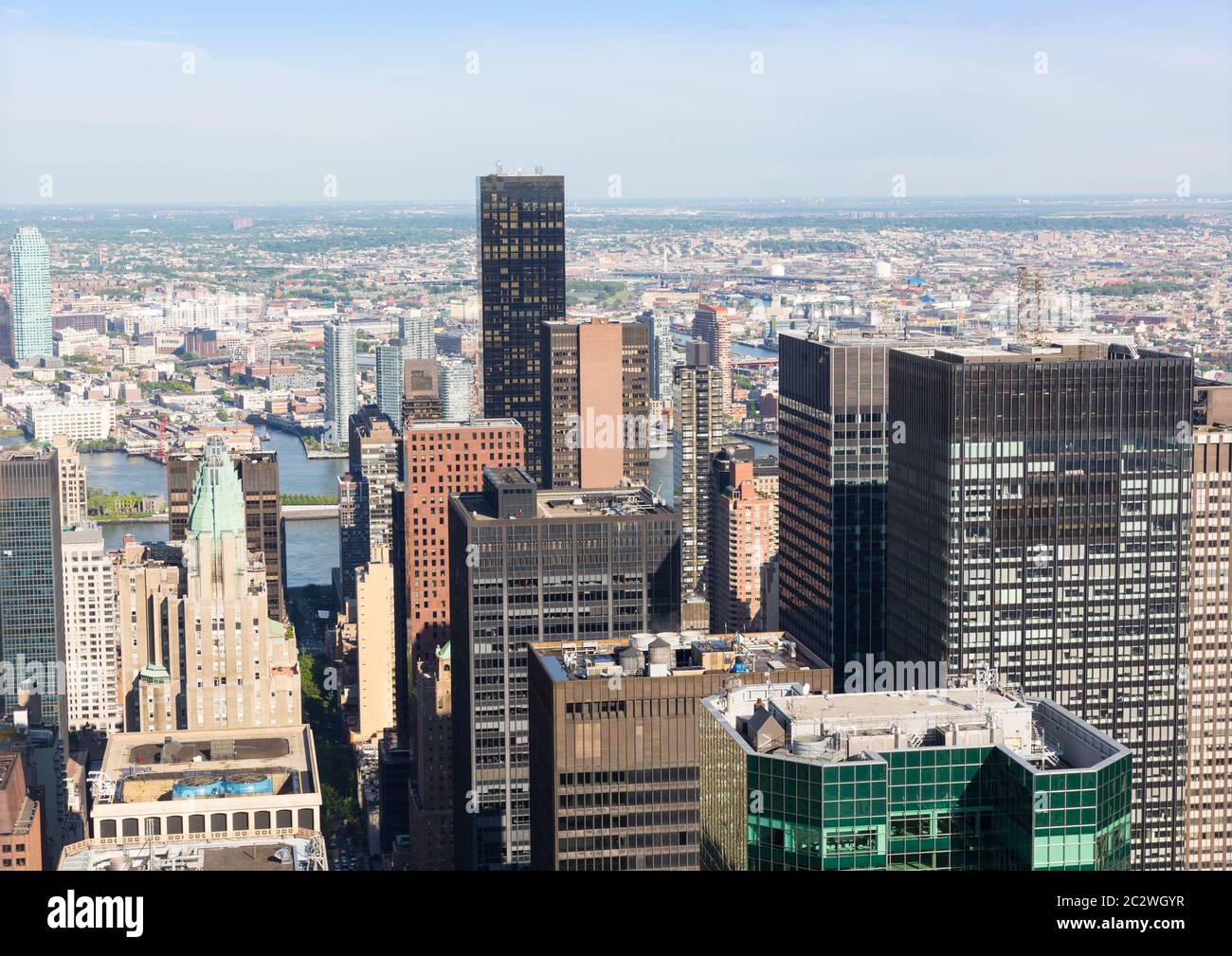 New York City Manhattan midtown aerial view with skyscrapers and blue ...