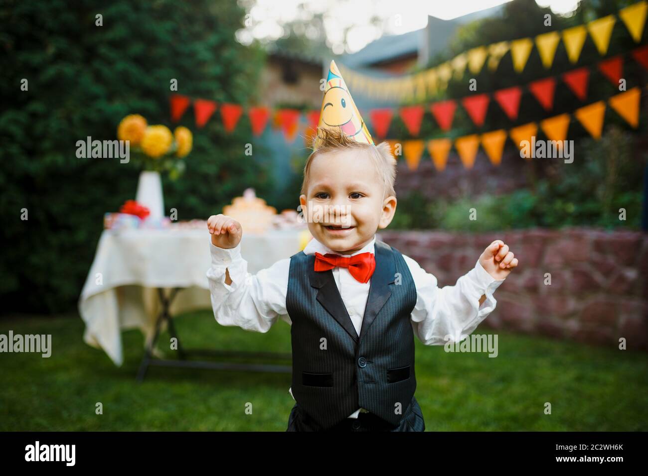 Table Set For Kids Birthday Party Outdoors In Garden and Cute boy on ...