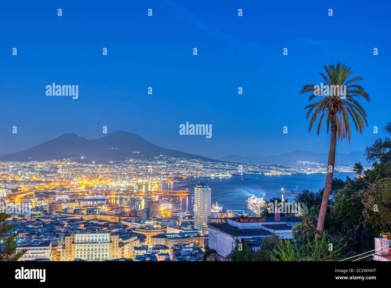 Naples in Italy with Mount Vesuvius at dusk seen from Vomero hill Stock ...
