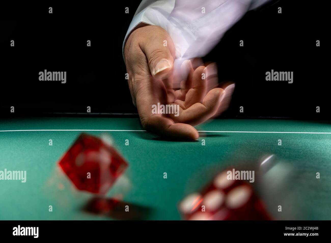 Man throwing dice at craps table hi-res stock photography and images ...