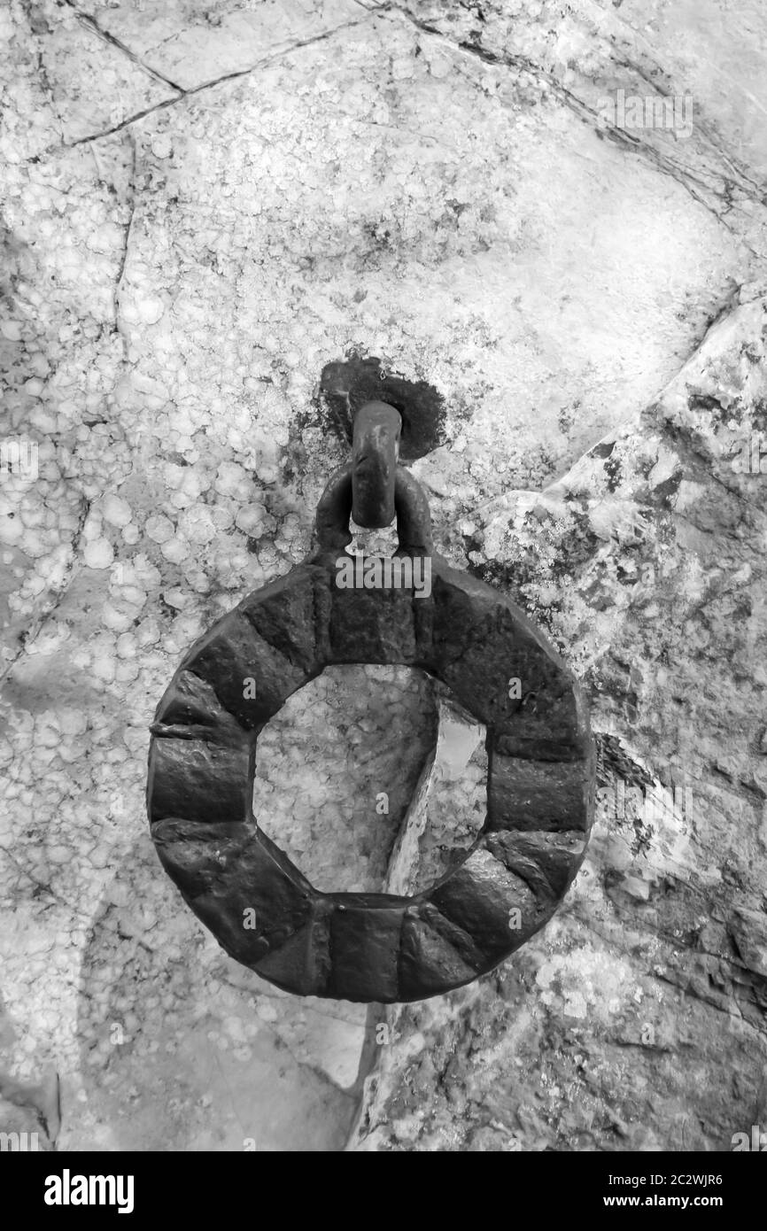 rusty iron rings for attaching things, objects Stock Photo - Alamy