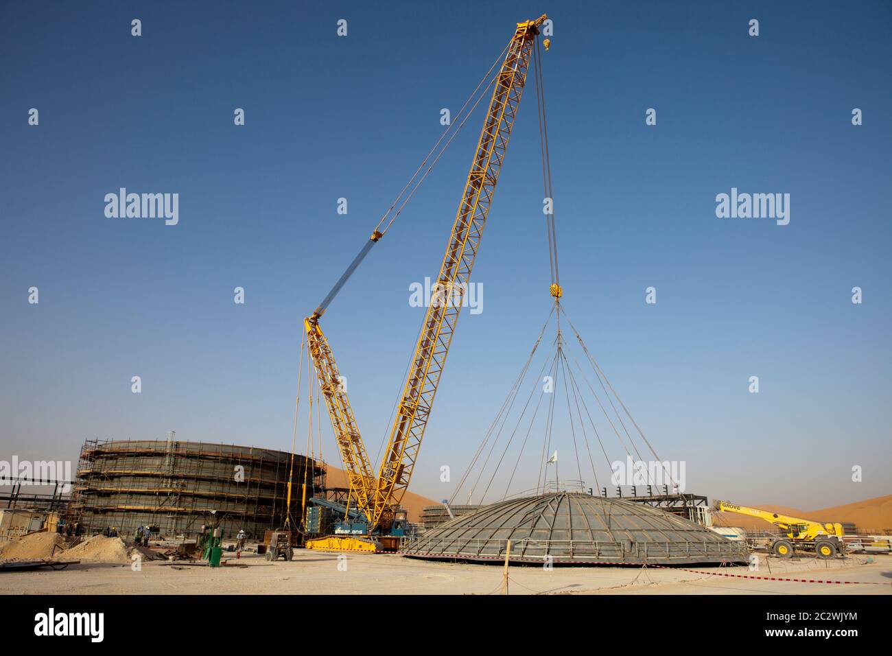 A heavy lift of a large lid begins. This will be to be fitted to the ...