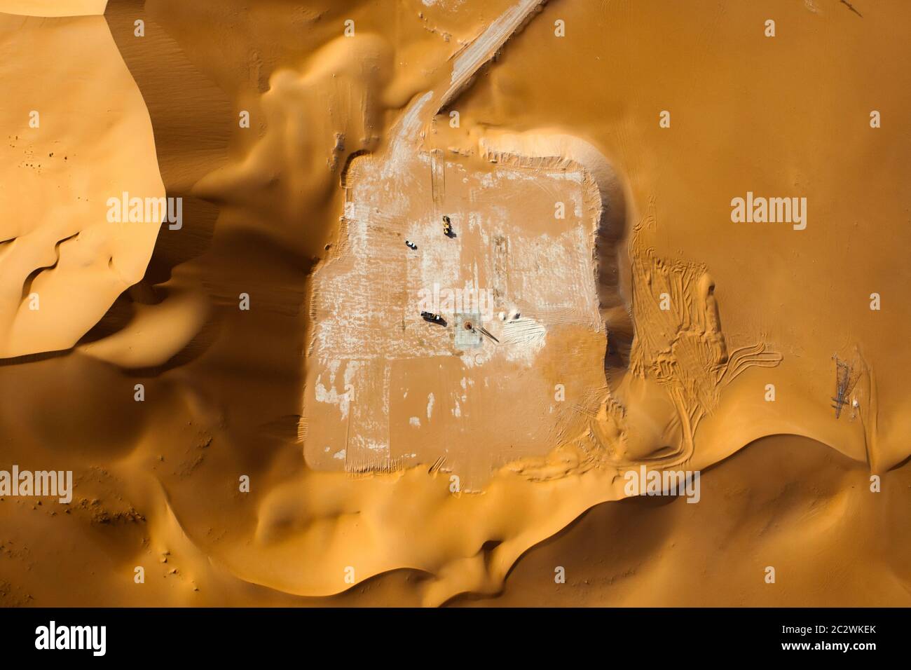 A capped off oil well in the Sahara desert awating connection to a ...