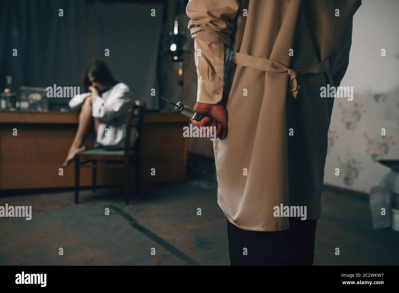 Psychiatrist with syringe and crazy female patient, mental hospital ...