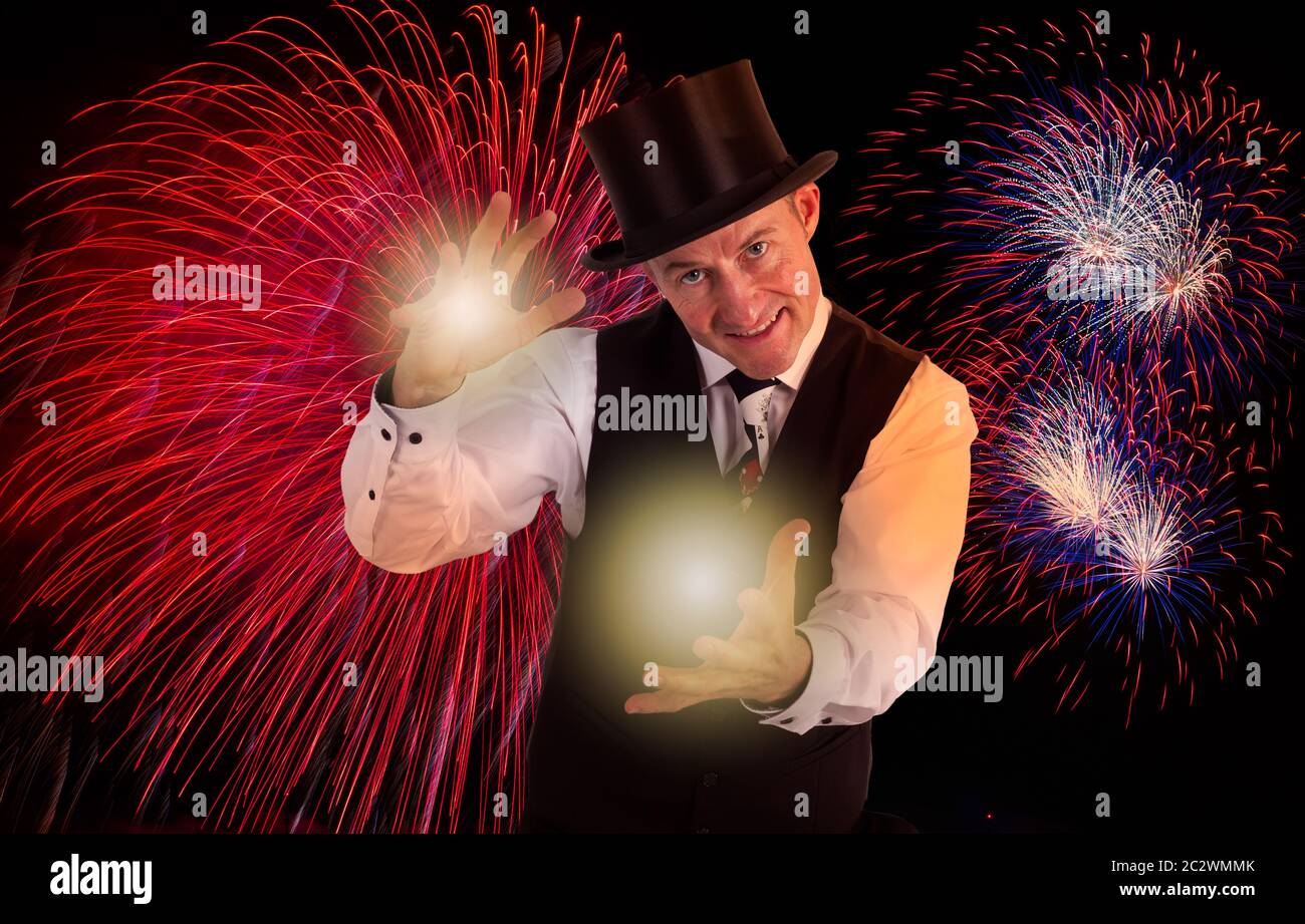 magician in front of fireworks with gesture Stock Photo - Alamy