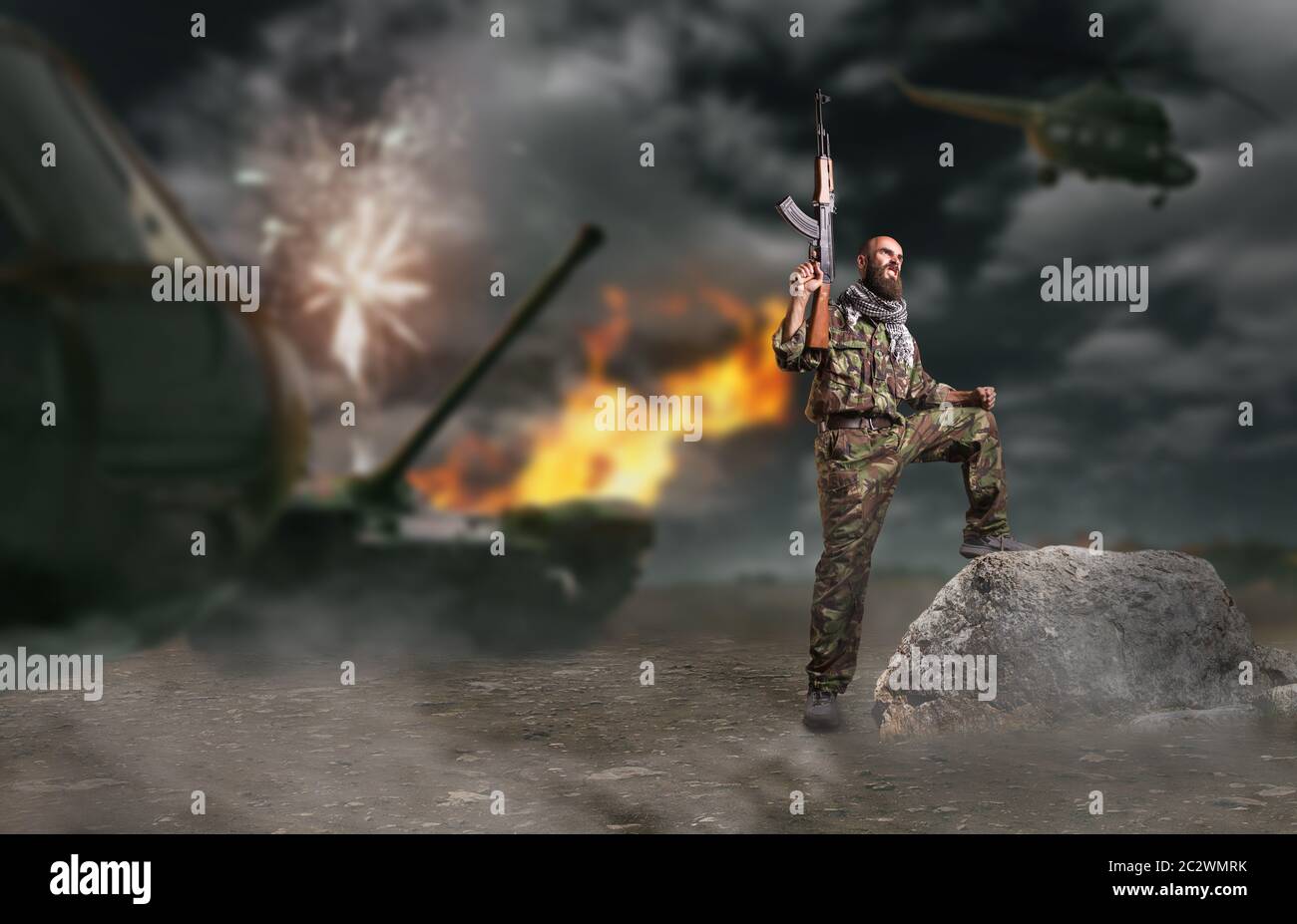 Bearded terrorist holding the kalashnikov rifle up. Terrorism and ...