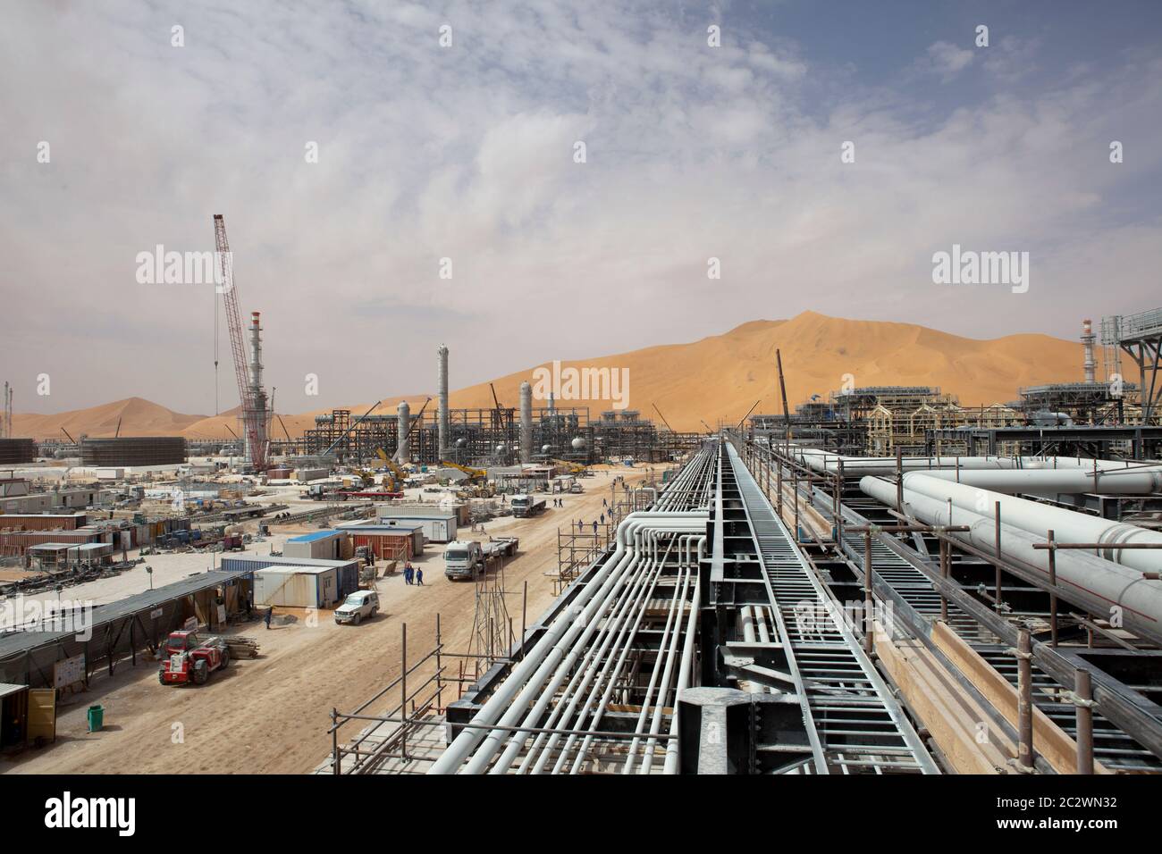Pipe runs near completion during the construction of a new oil facility ...
