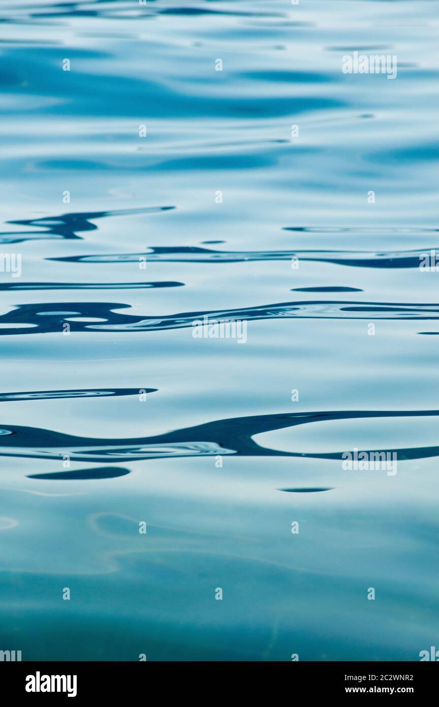 Smooth and soft curves of the water surface slightly rippled Stock ...