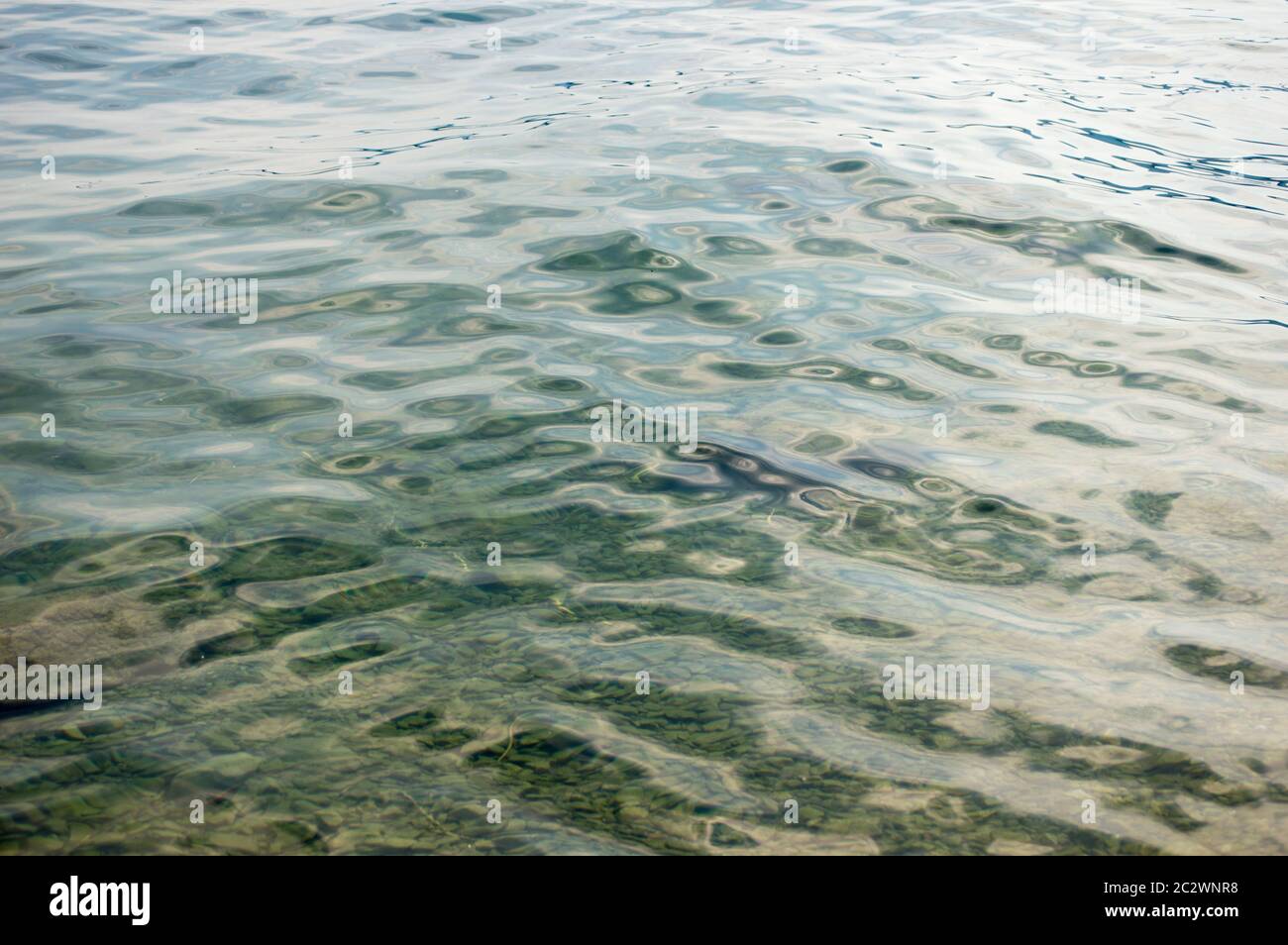 Smooth and soft curves of the water surface slightly rippled Stock ...