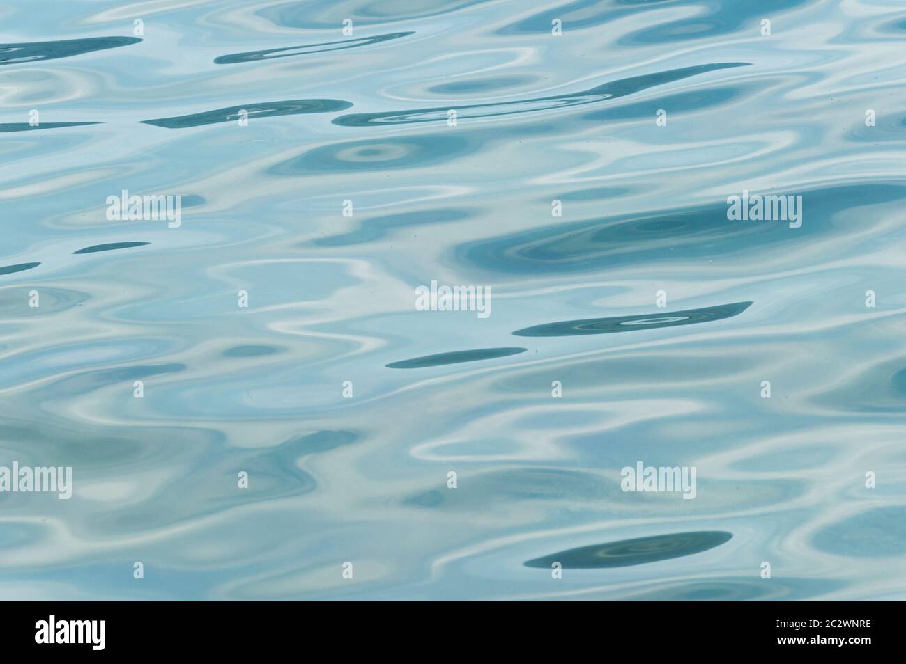 Smooth and soft curves of the water surface slightly rippled Stock ...