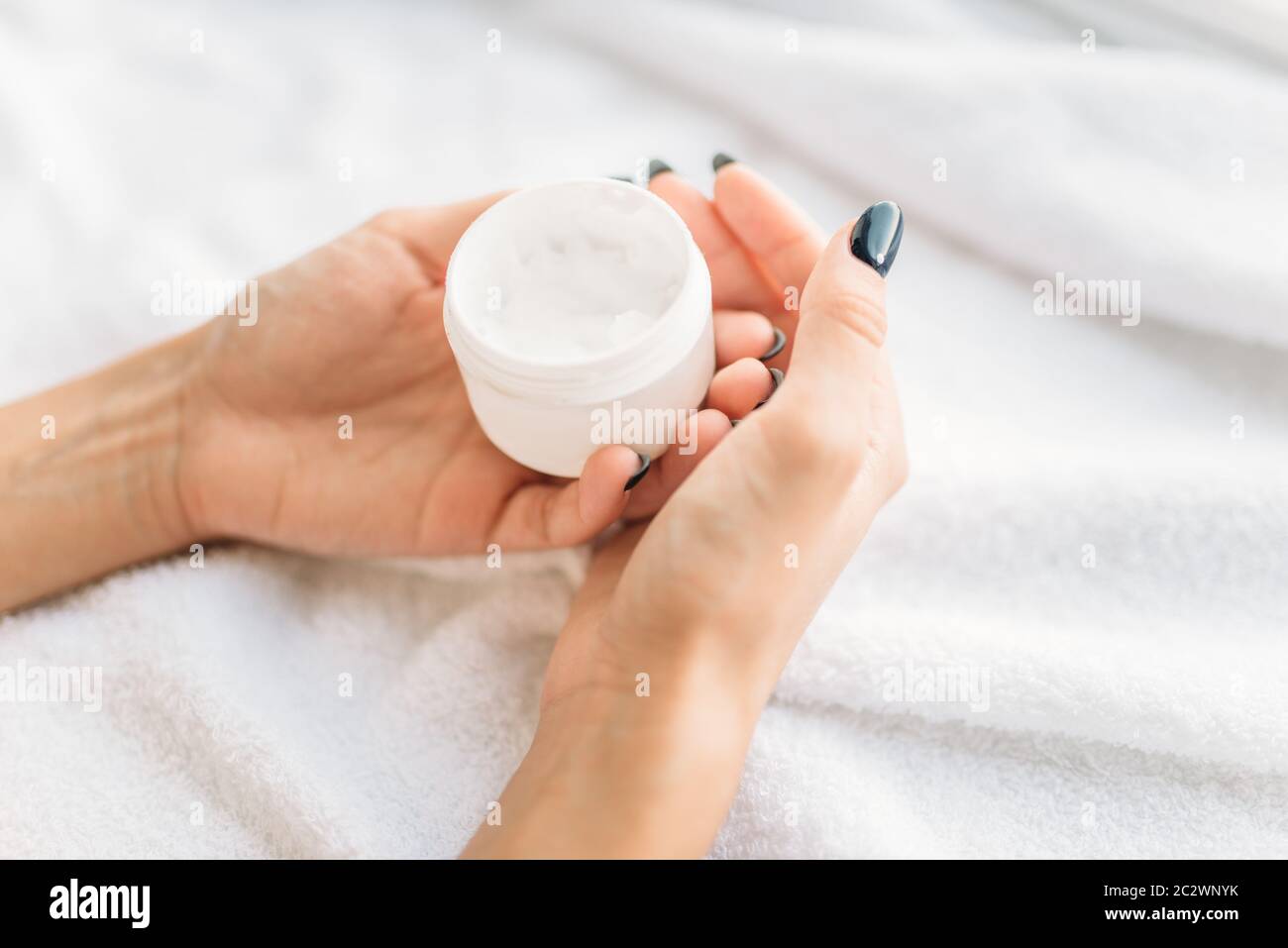 Female person hands with cosmetic cream closeup, skincare. Bodycare and ...