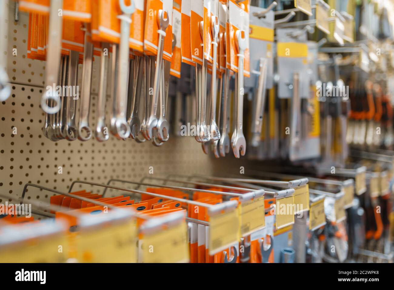 Hardware store assortment, shelf with wrenches, nobody. Building ...