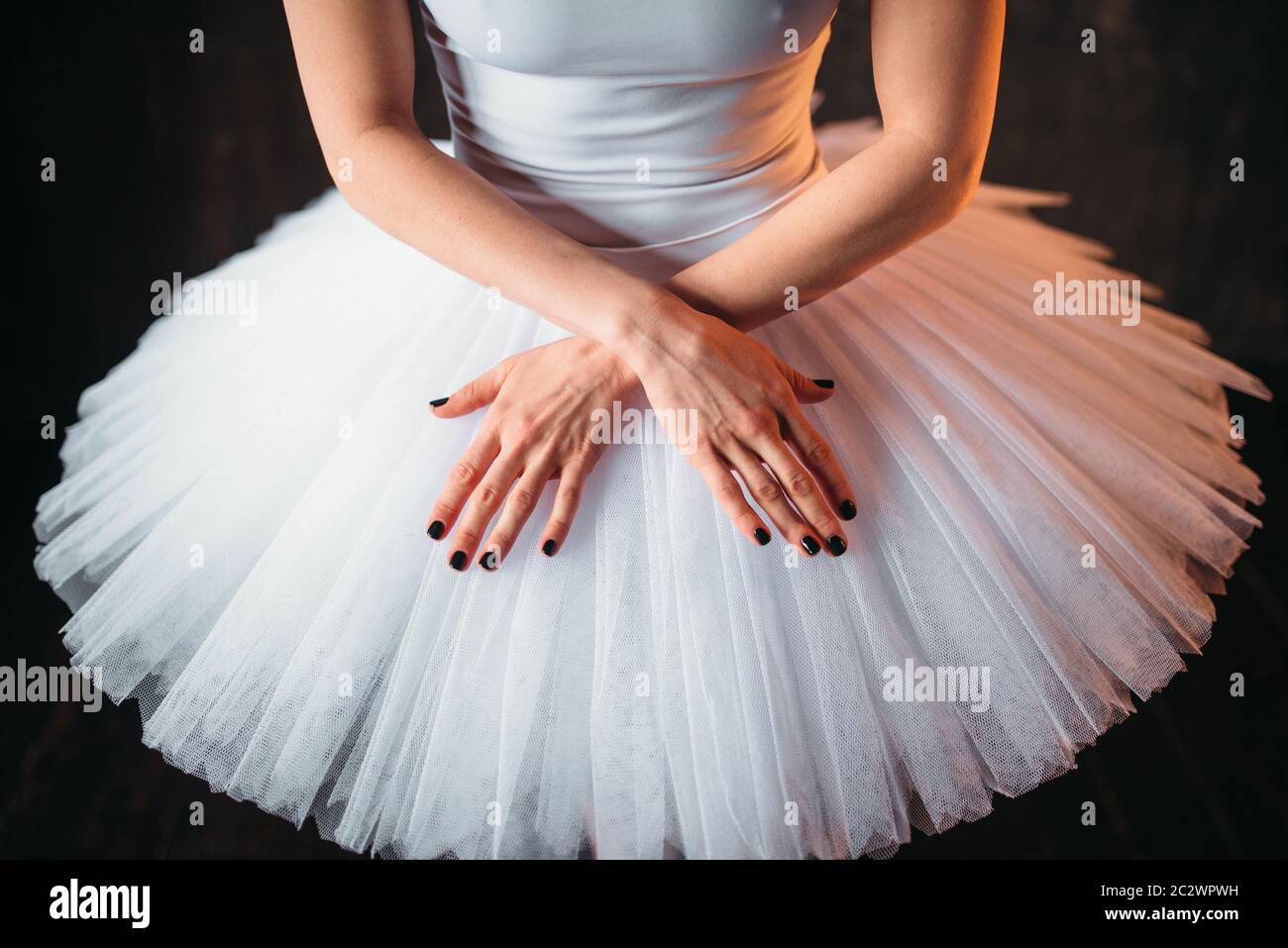 Classical ballet dancer body in white dress and cross hands, black ...
