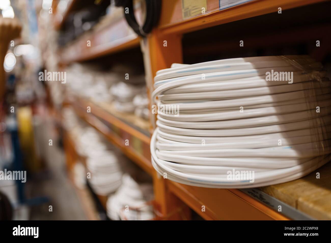 Hardware store assortment, shelf with wiring, nobody. Building ...