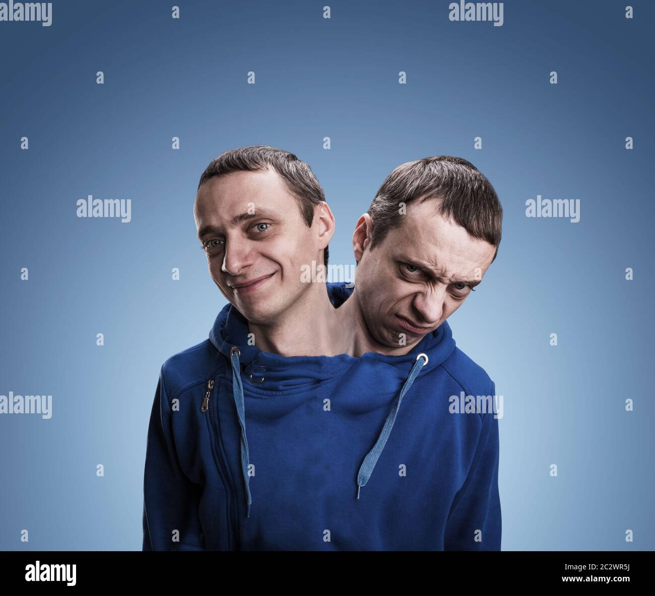 A man with two heads over blue background Stock Photo - Alamy