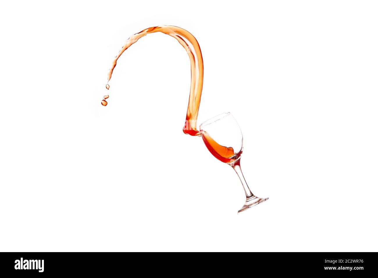 Red wine splash, wine splashing in a wine glass against a white ...