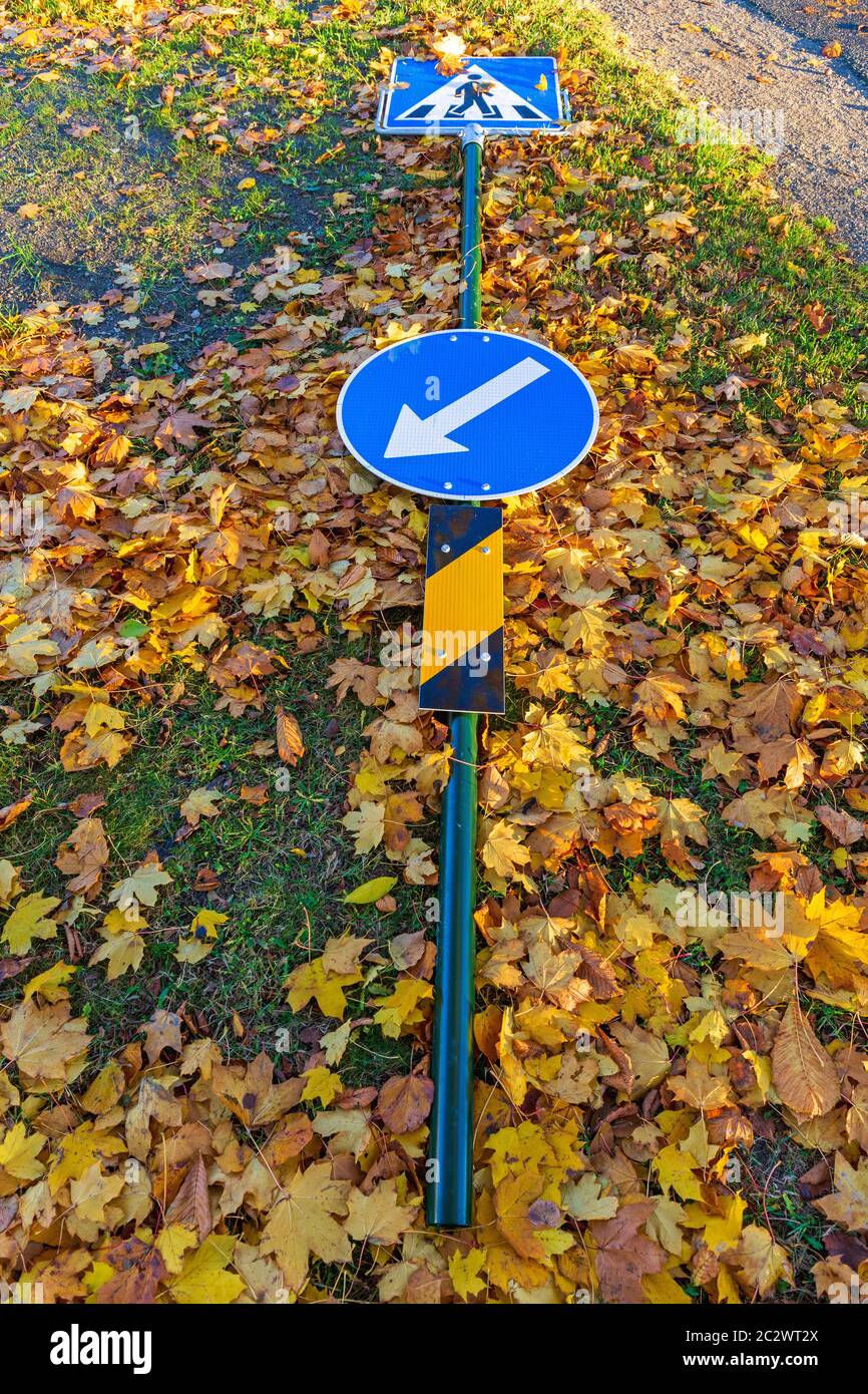 Direction Arrow Traffic Sign Pole at Ground Stock Photo - Alamy