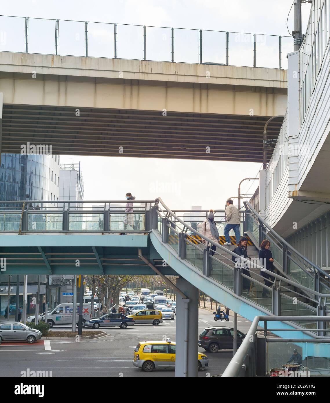 People crossing road bridge Shanghai Stock Photo - Alamy