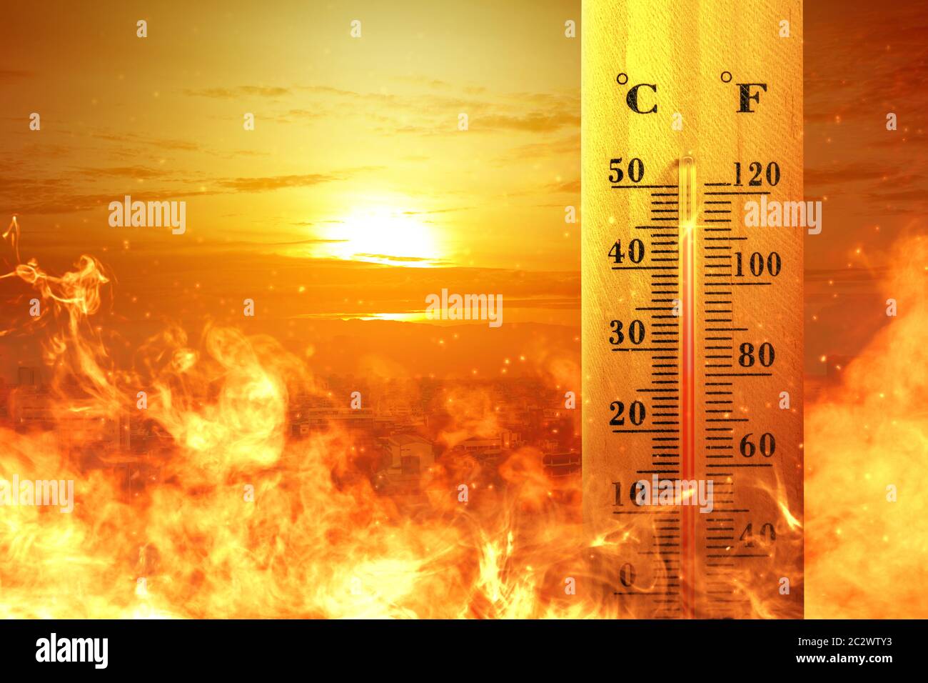 Thermometer with high temperature on the city with glowing sun ...
