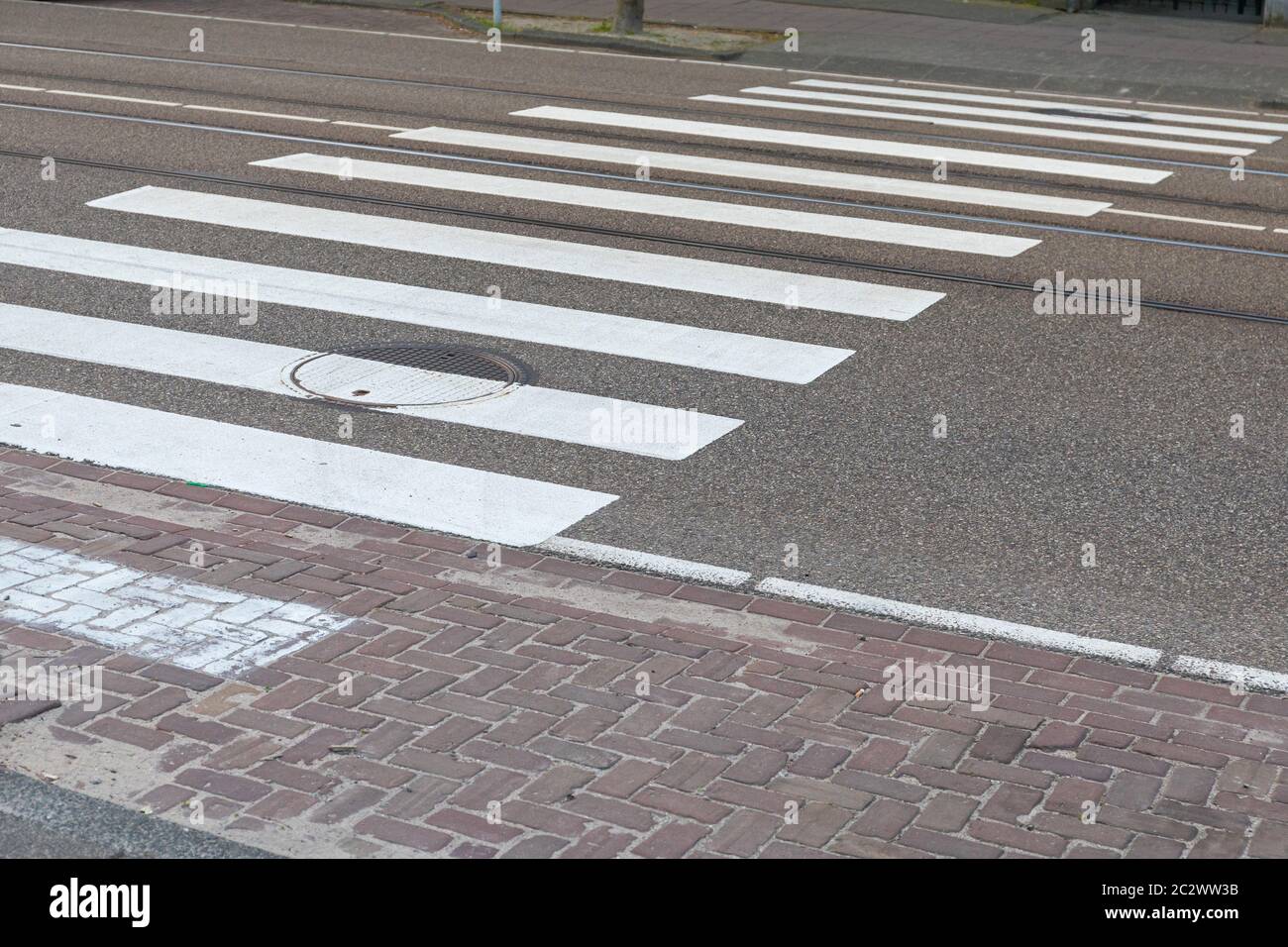 Pedestrians crossing street in amsterdam hi-res stock photography and ...
