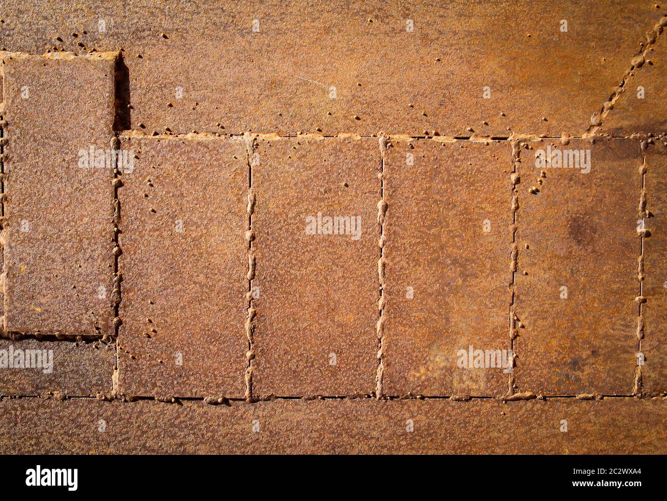 rusty welded plates of iron as a texture Stock Photo - Alamy