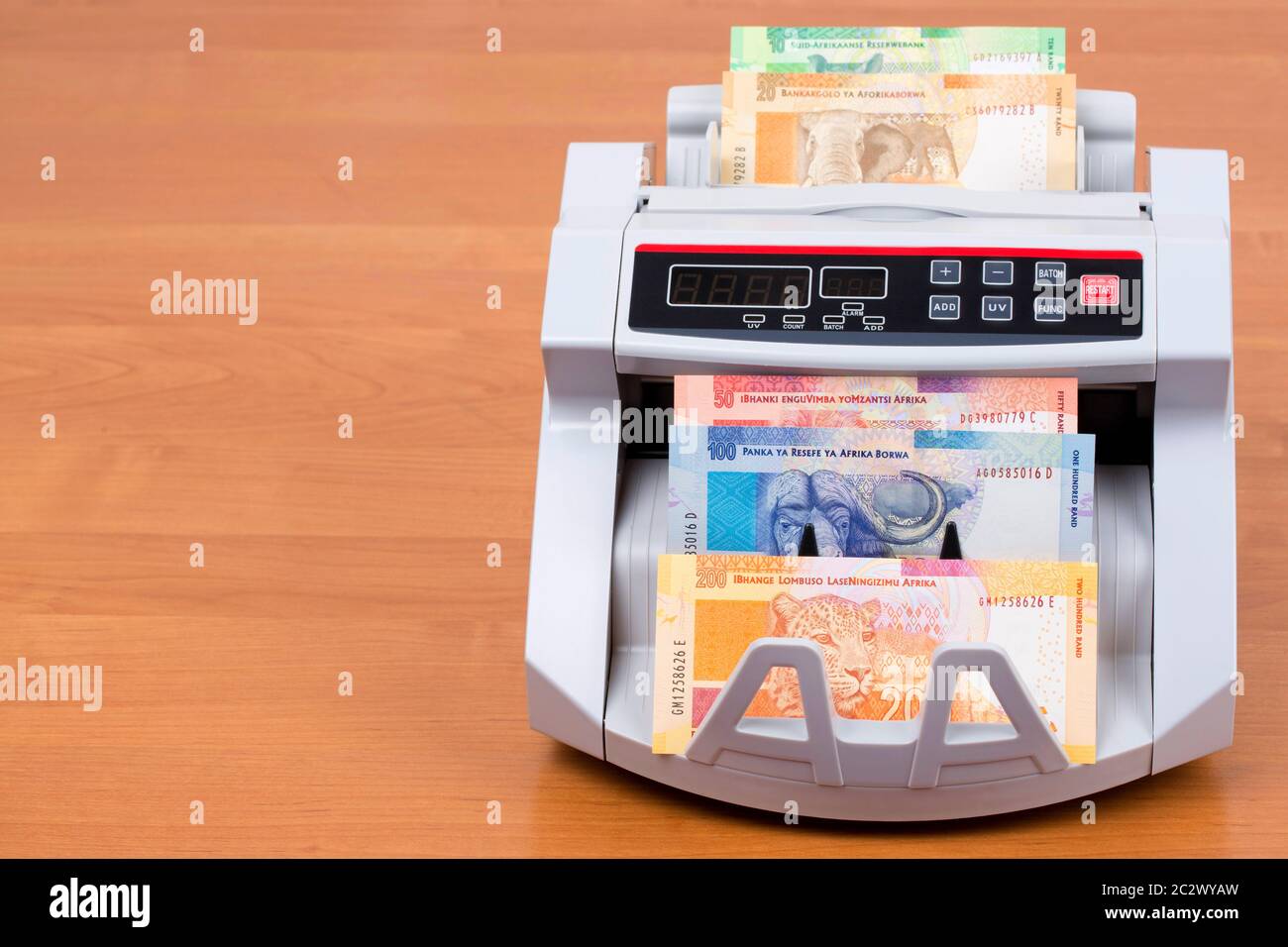 South African money in a counting machine Stock Photo - Alamy