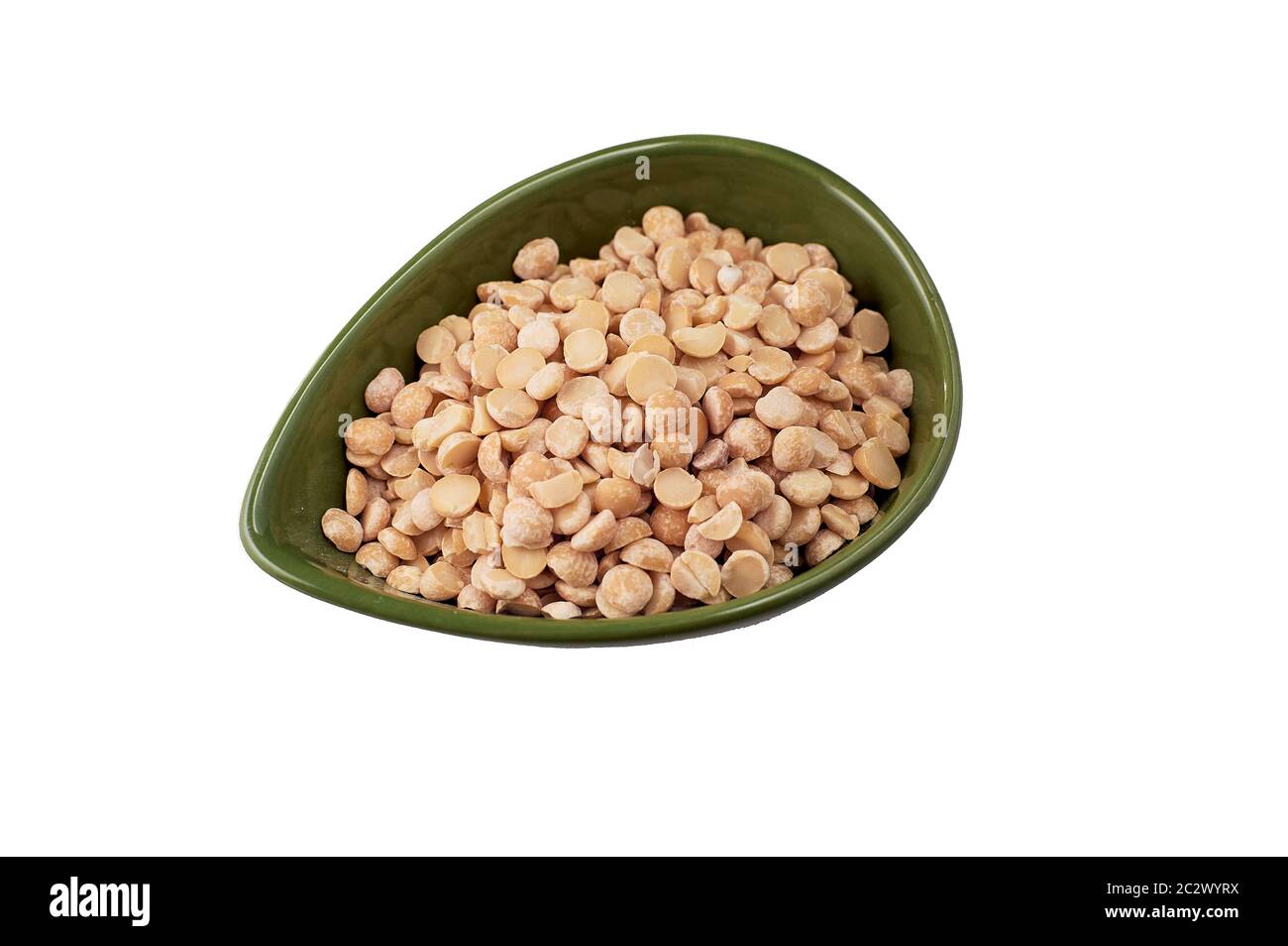 Raw yellow split peas in a green plate bowl isolated on white ...