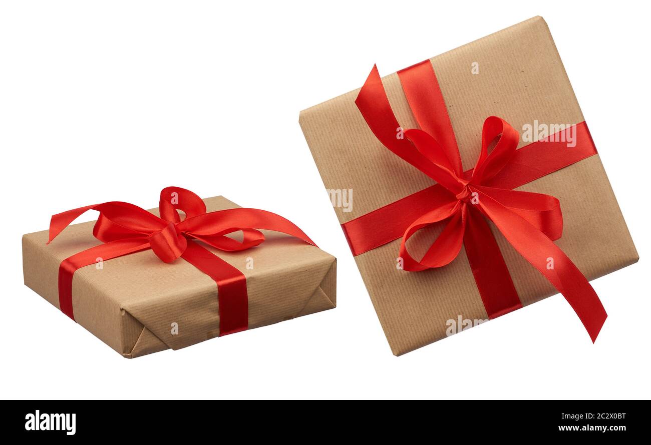 square box wrapped in brown kraft paper and tied with a silk red ribbon ...