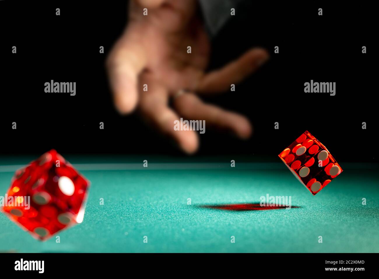 Man throwing dice at craps table hi-res stock photography and images ...