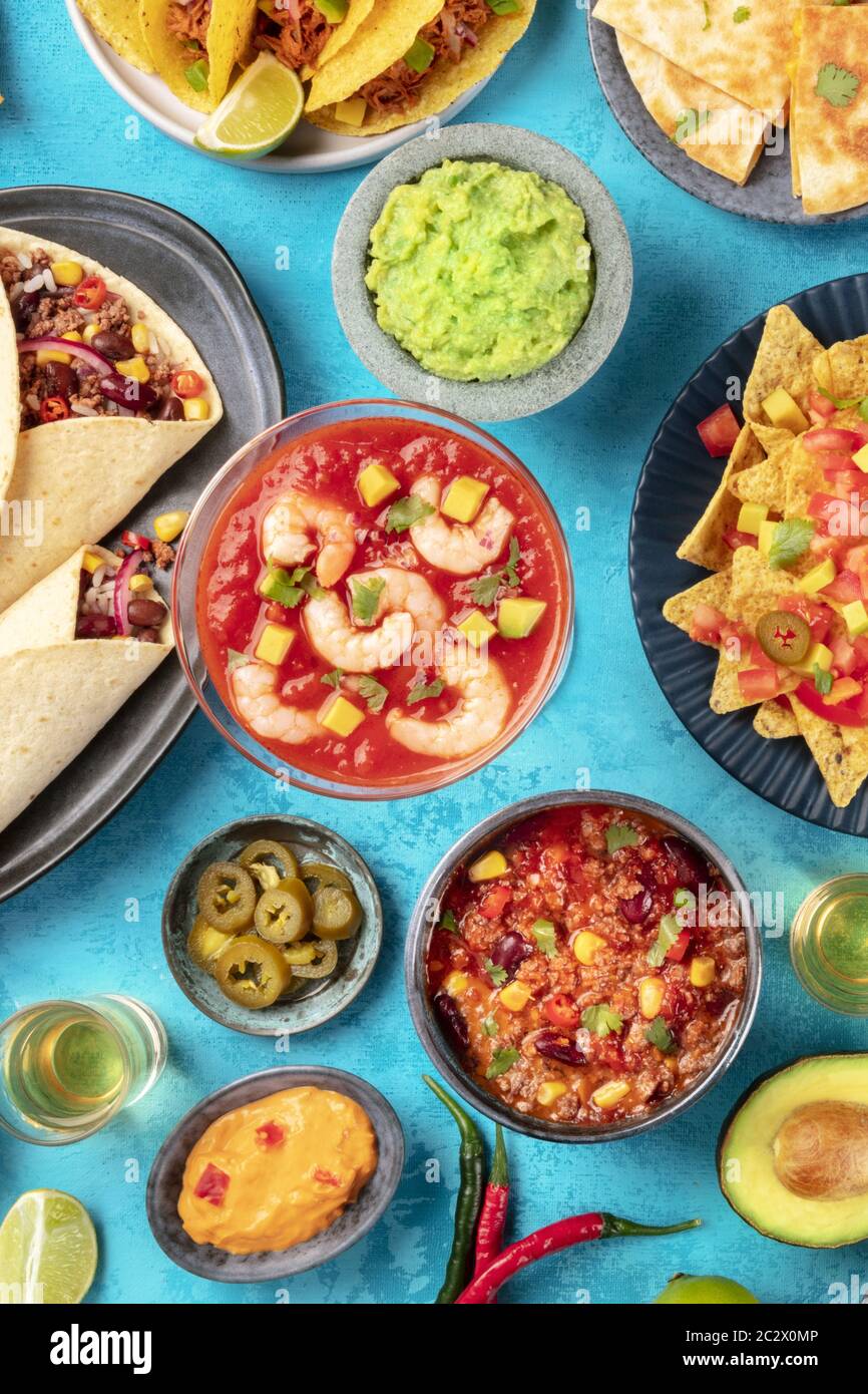 Mexican food, overhead flatlay shot on a vibrant blue background ...