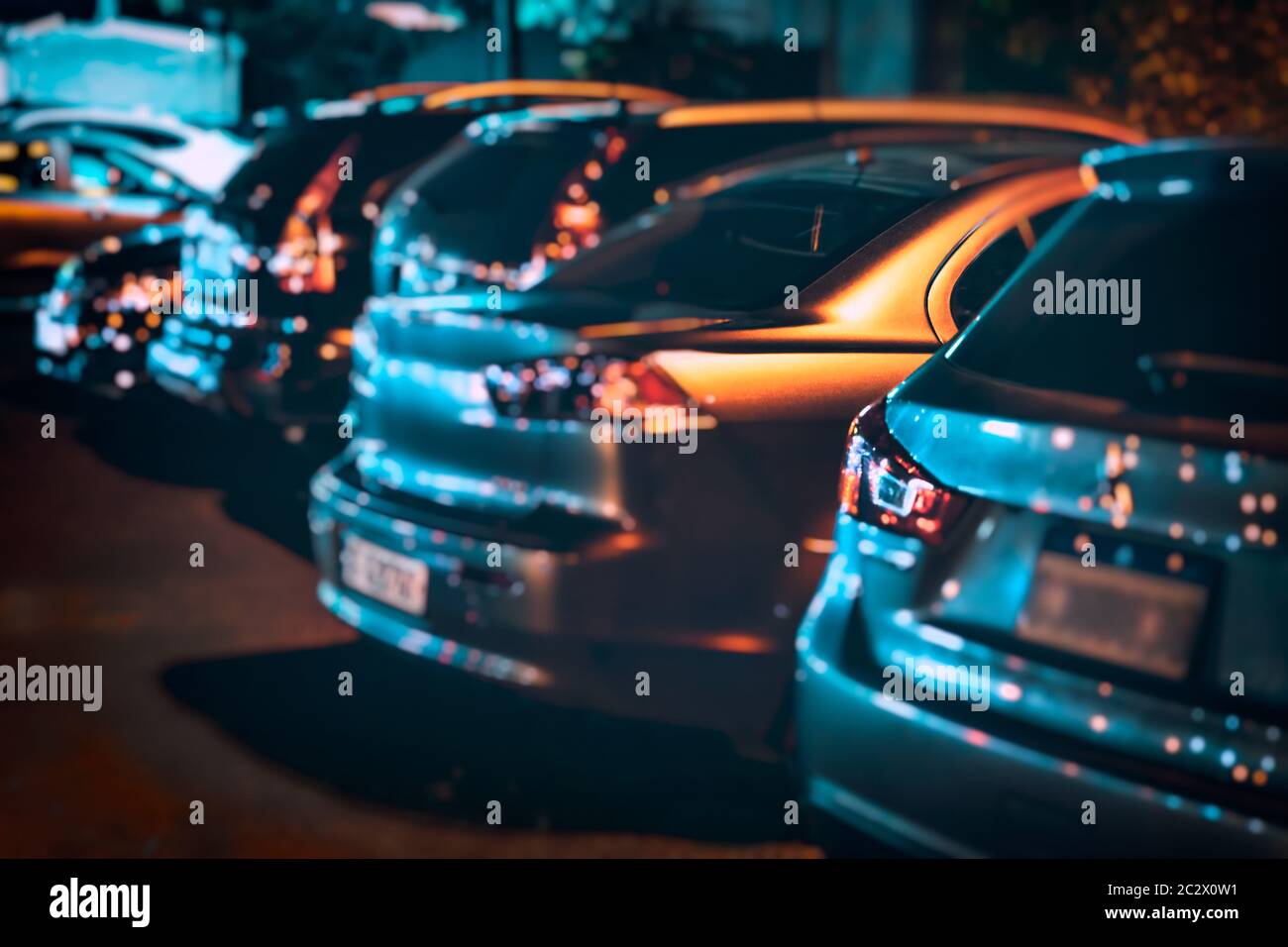Defocused, cars background, night paid parking, regular city street at ...