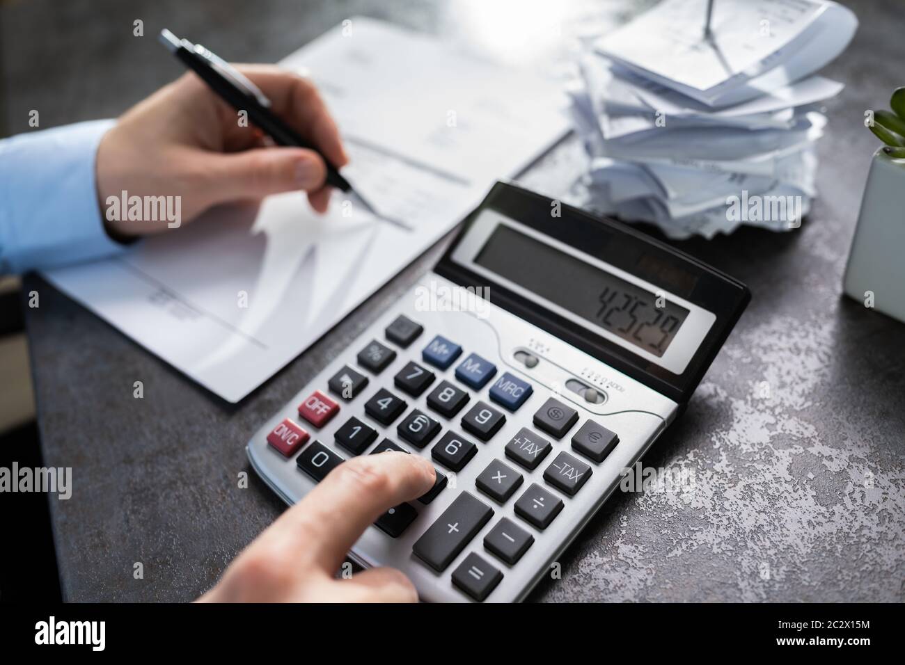 Male accountant calculating invoices hi-res stock photography and ...