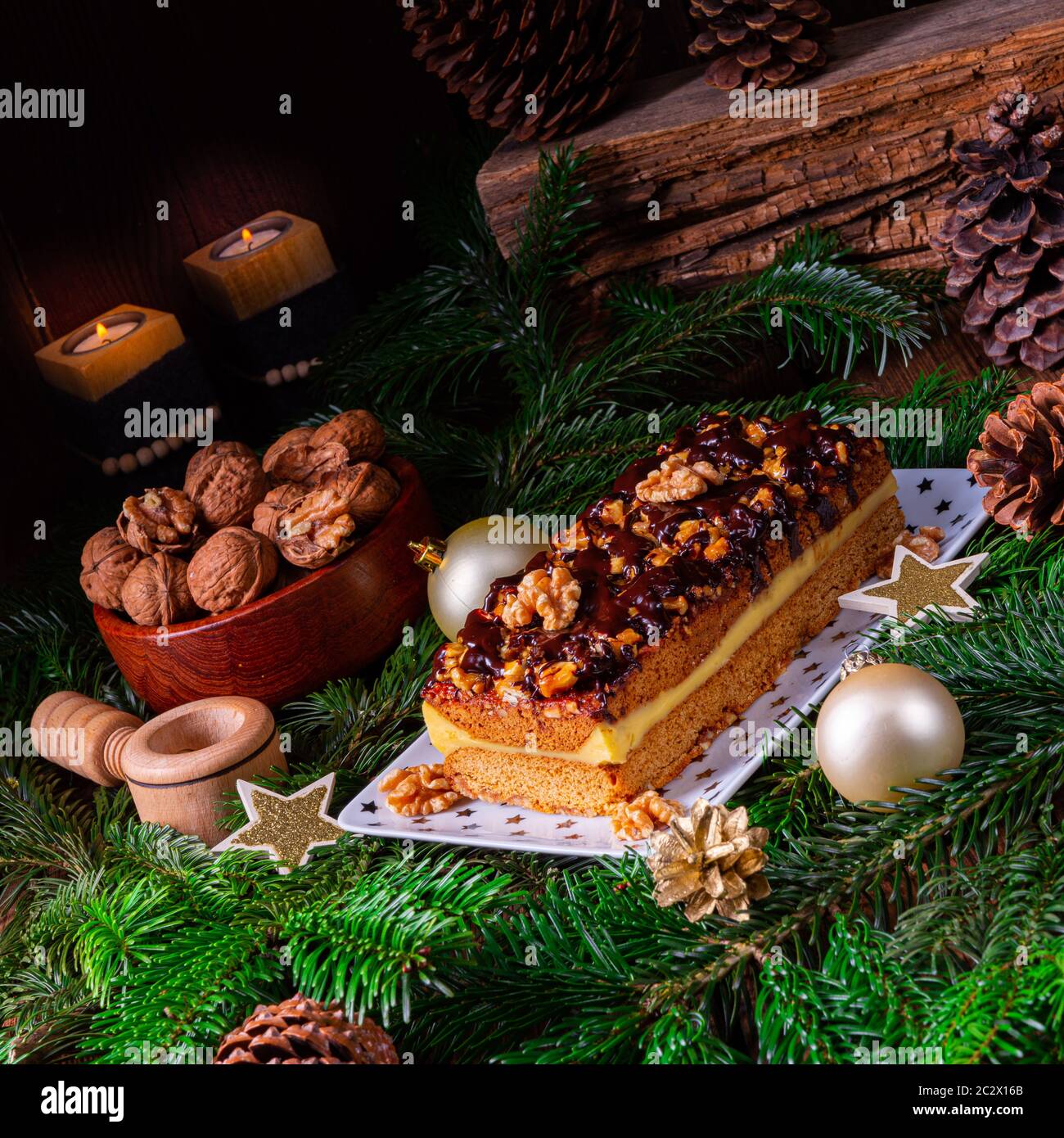 Chocolate gingerbread with filling, jam and nuts Stock Photo - Alamy