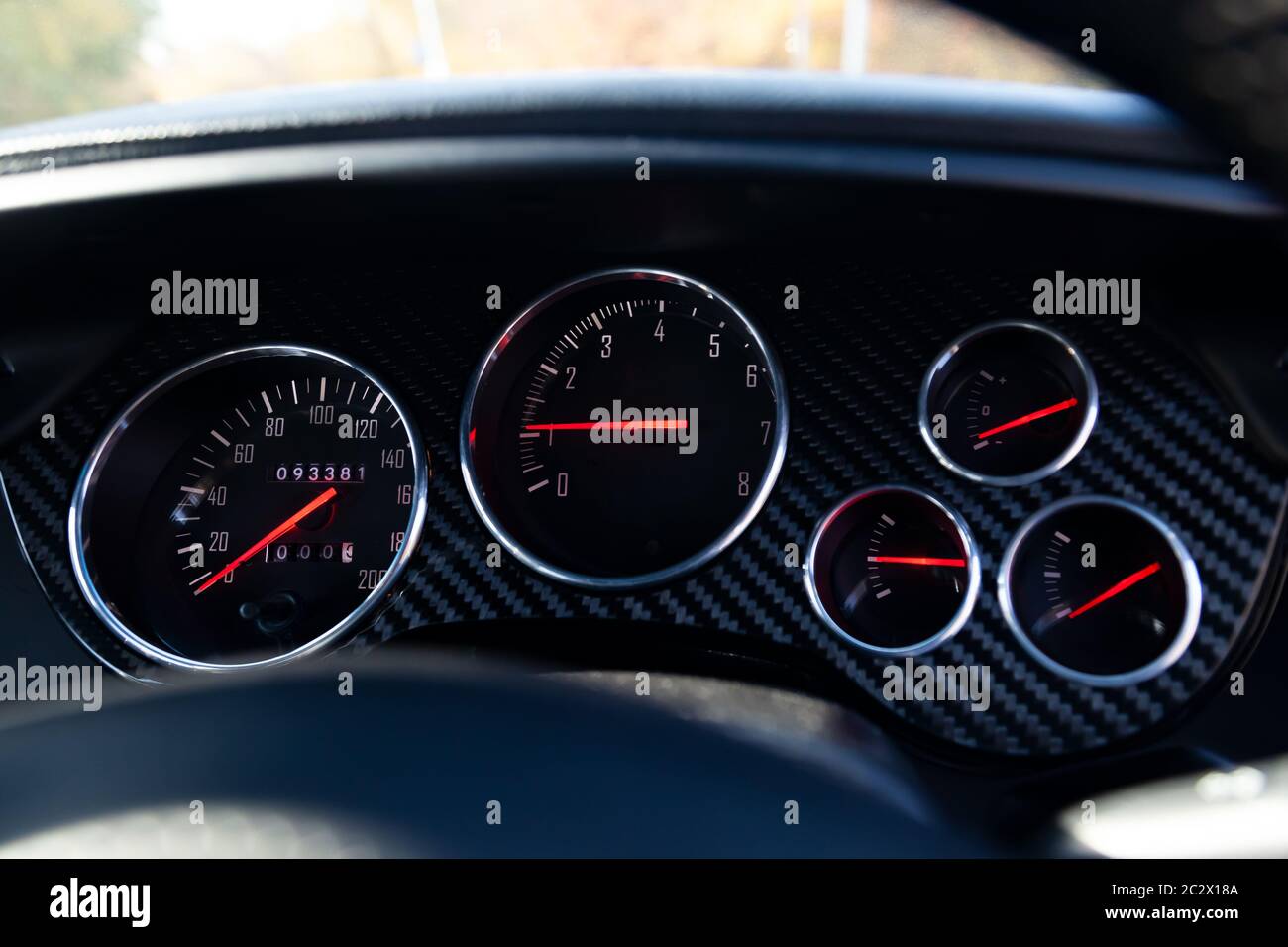 Stylish backlit dashboard with sensors for measuring speed, engine ...