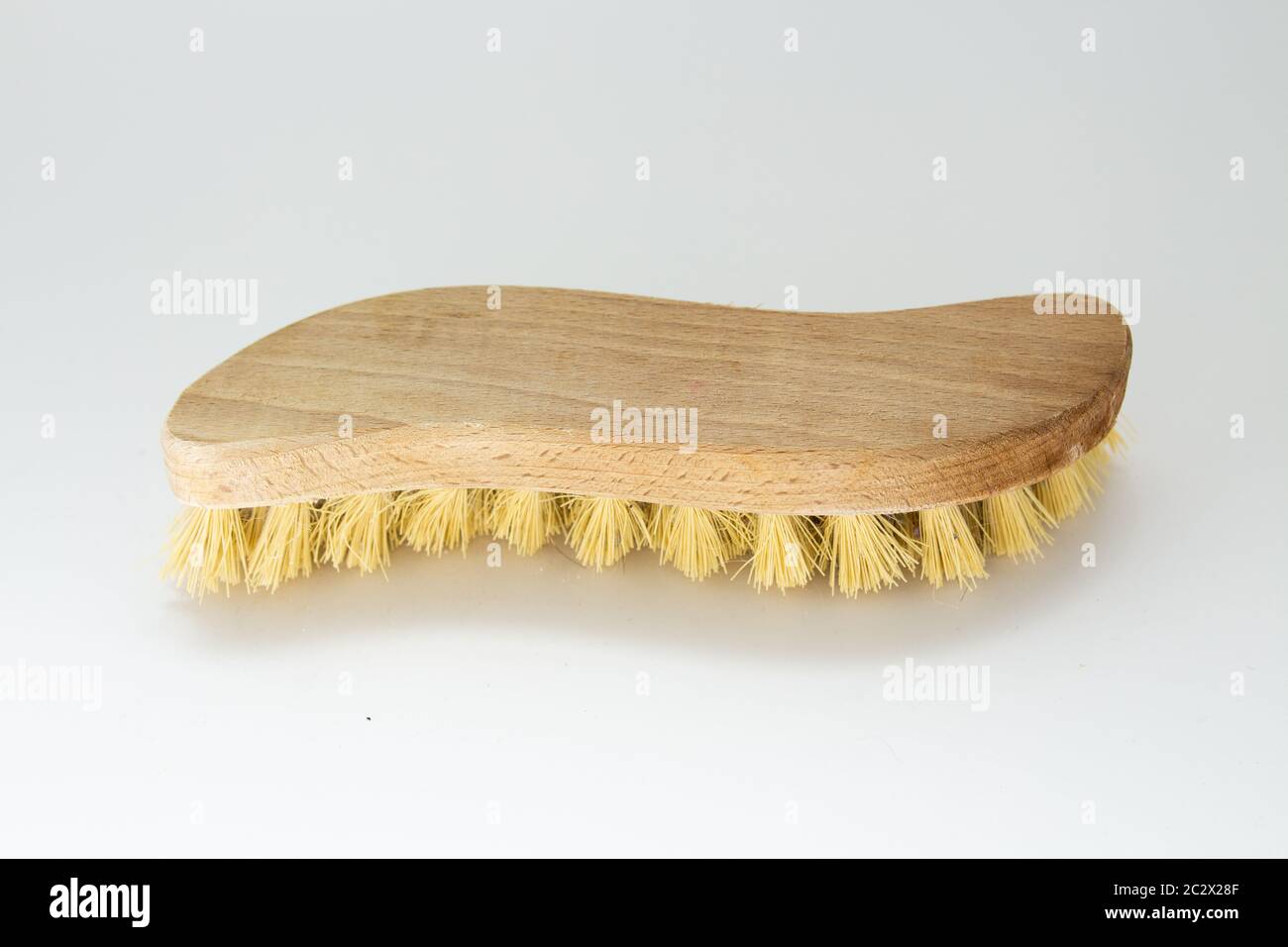 wooden cleaning brush on white background Stock Photo - Alamy