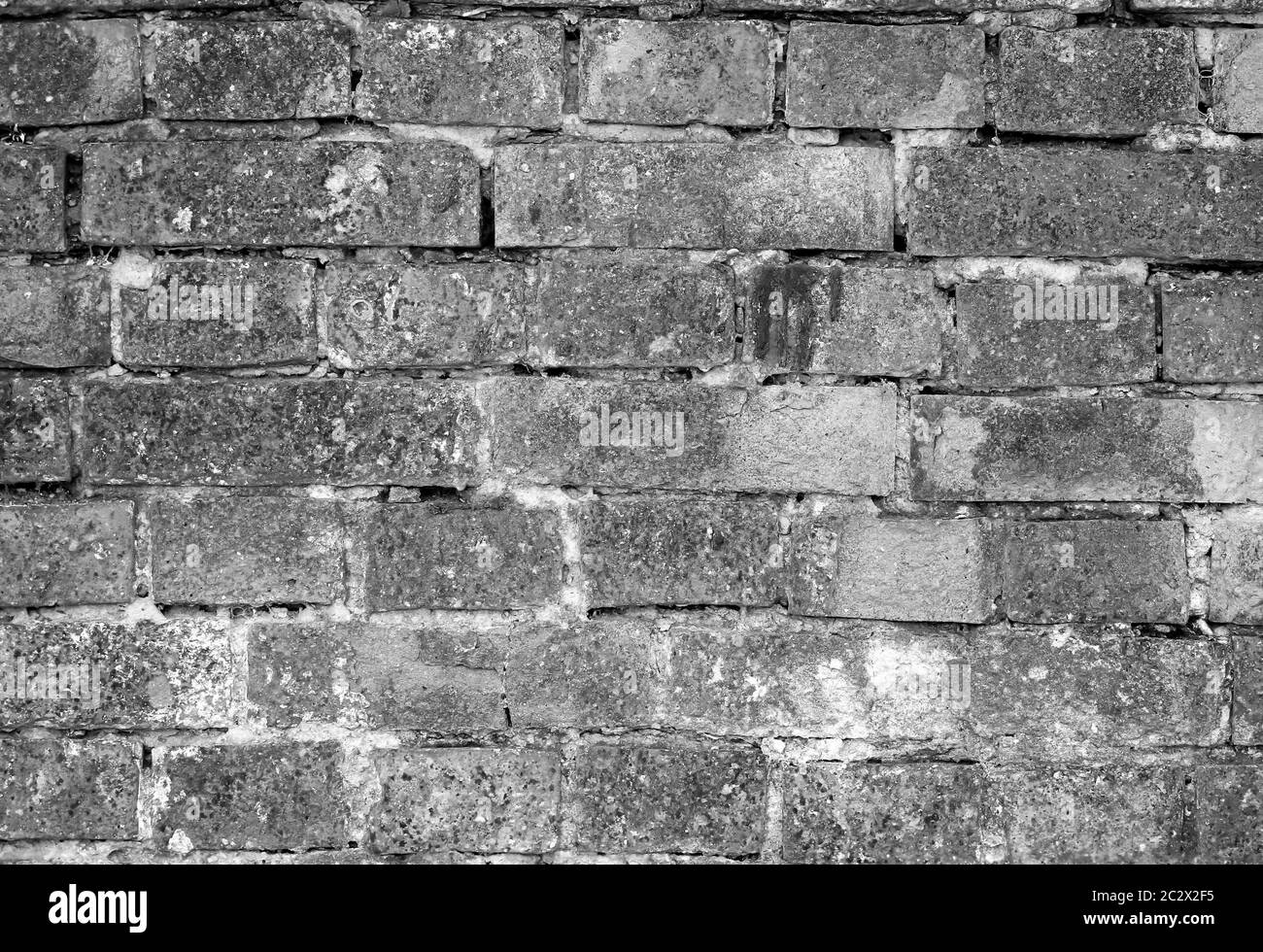 a stone wall, made of bricks, stone texture, background Stock Photo - Alamy