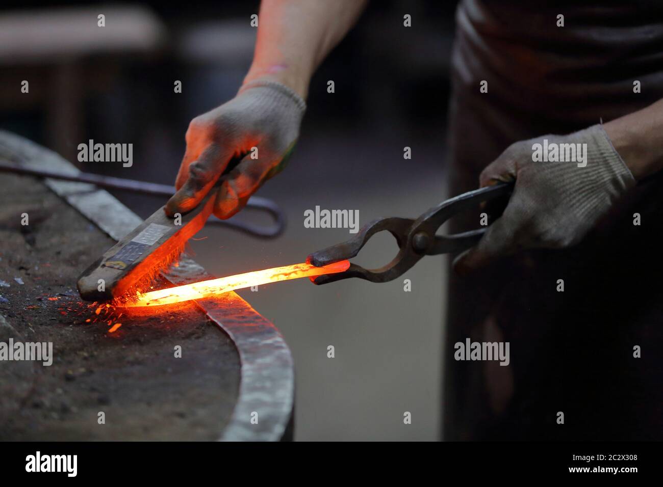 The process of manufacturing a craft product in a forge Stock Photo - Alamy