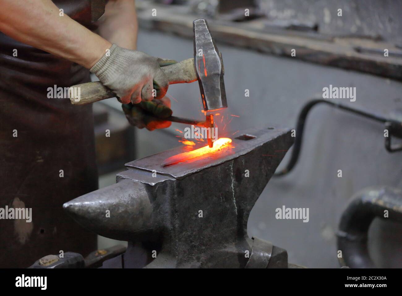 The process of manufacturing a craft product in a forge Stock Photo - Alamy