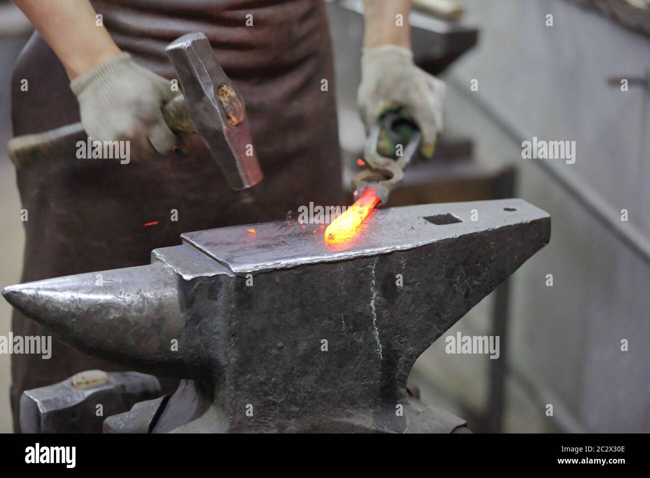 The process of manufacturing a craft product in a forge Stock Photo - Alamy