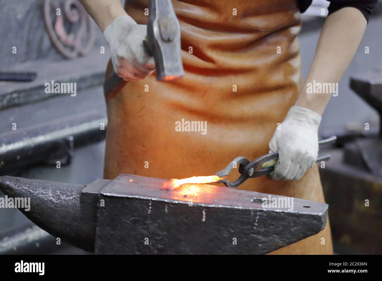 The process of manufacturing a craft product in a forge Stock Photo - Alamy