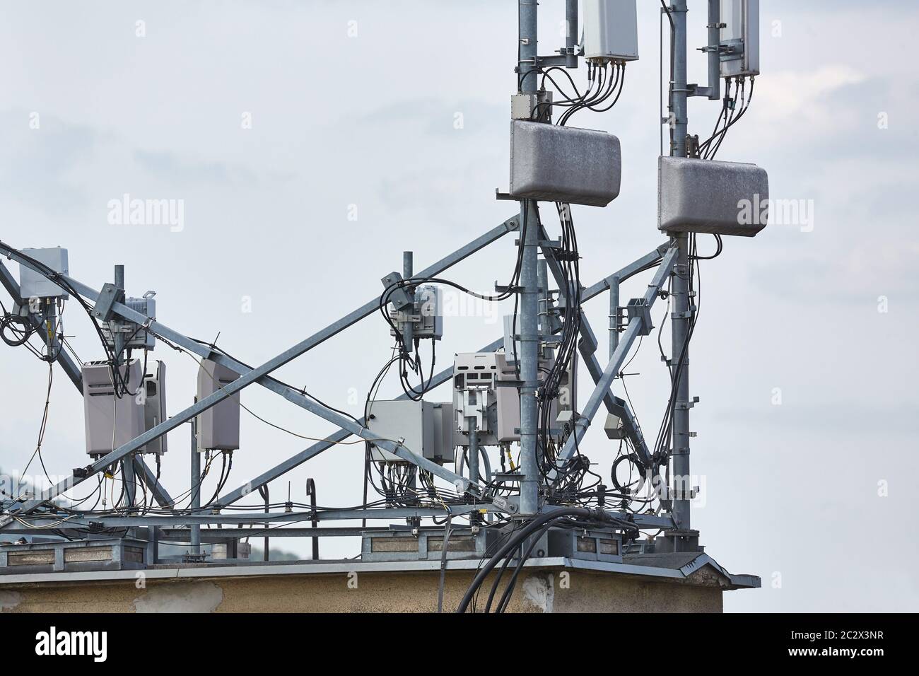 Signal transmittes on a building roof Stock Photo - Alamy