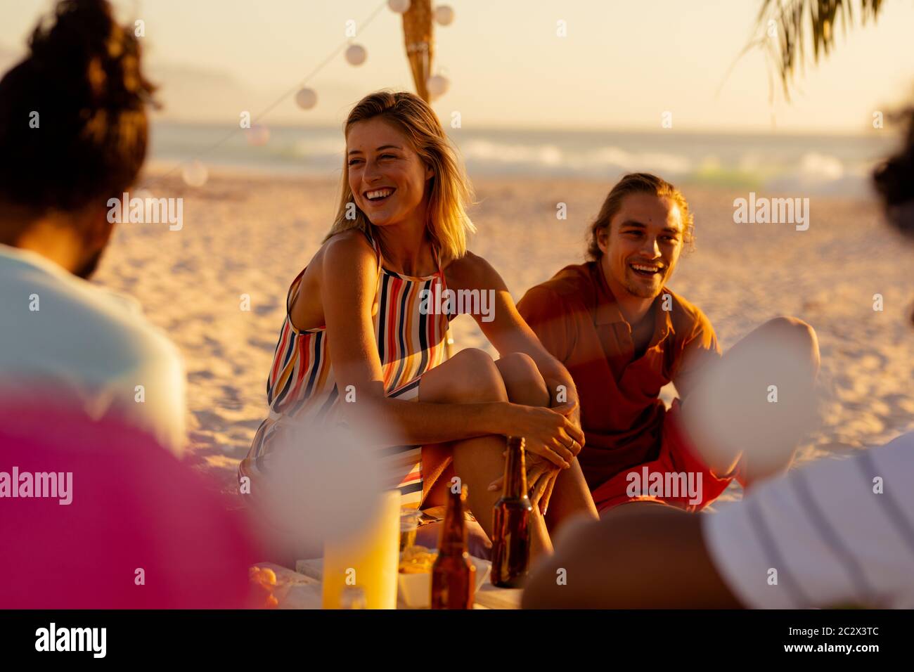 Group of young people having fun on the beach hi-res stock photography ...