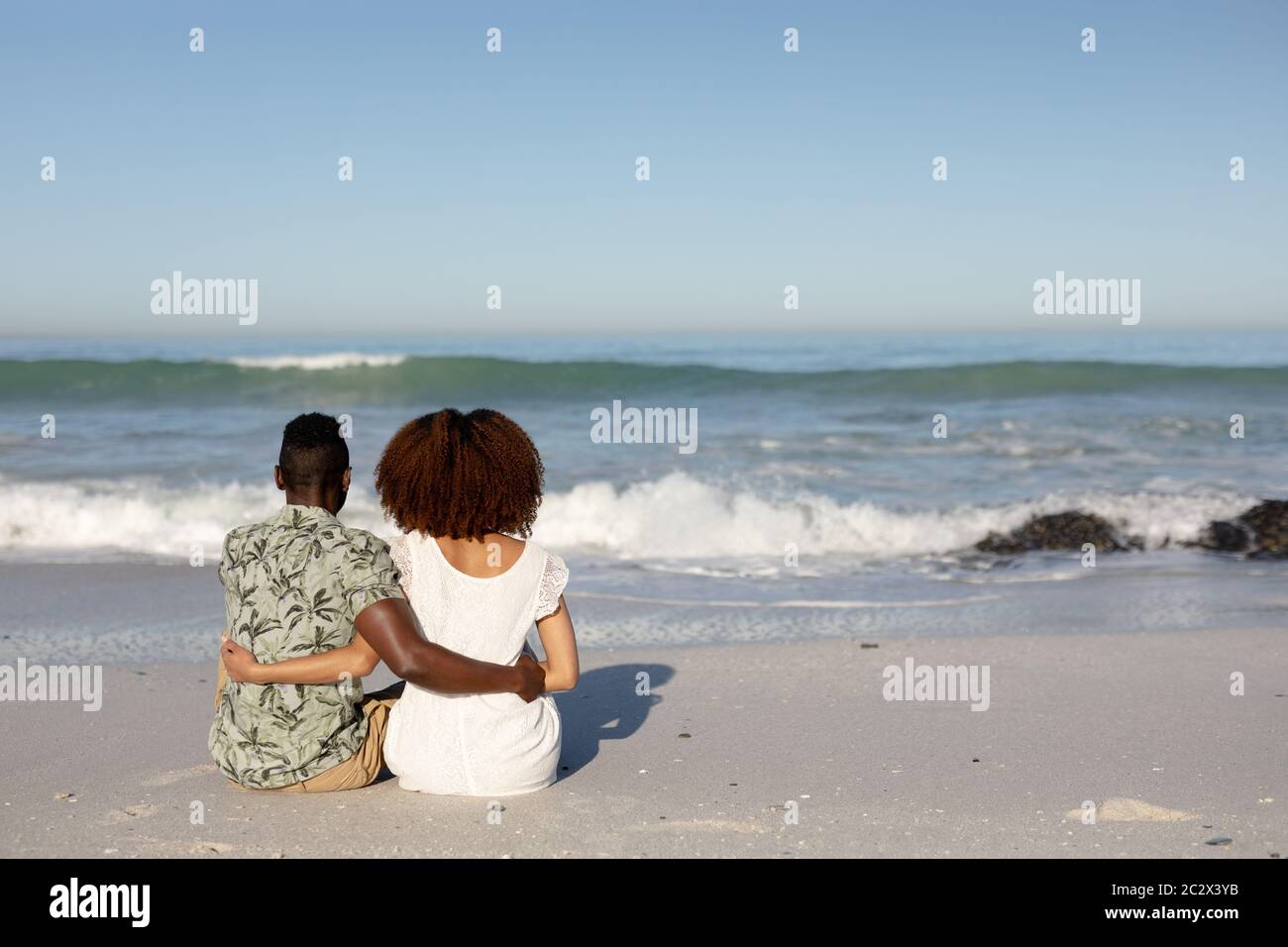 Happy couple spending time together on the beach Stock Photo - Alamy