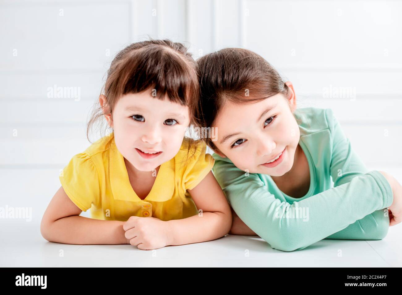 closeup Two little girls face together Stock Photo - Alamy